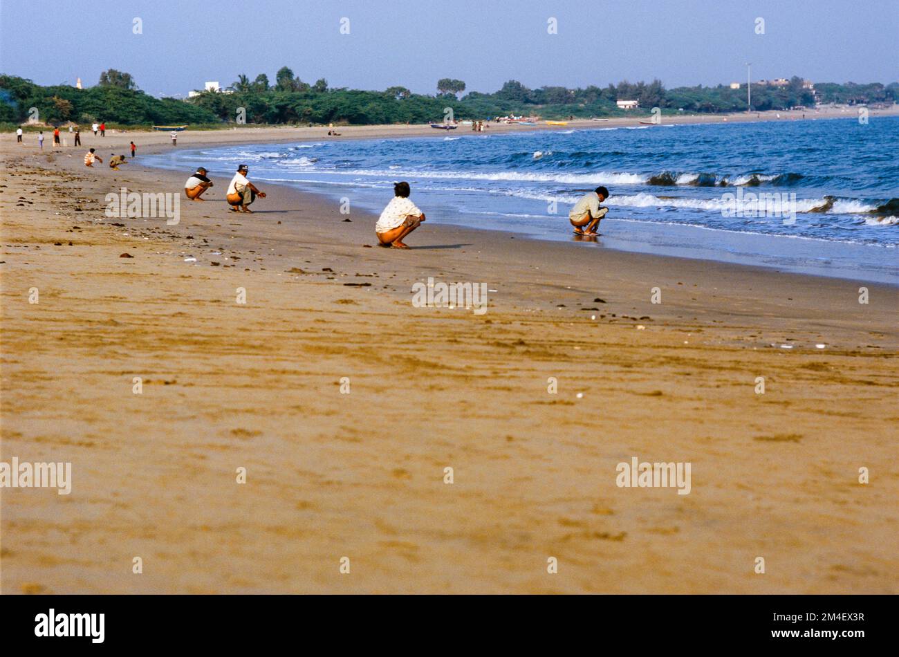 Defecating men on the beach, using it as public toilet. Googhla , India ...
