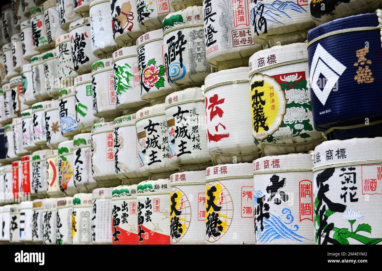 Colorful Sake barrels at the gravel road entrance to the Meiji Jingu ...