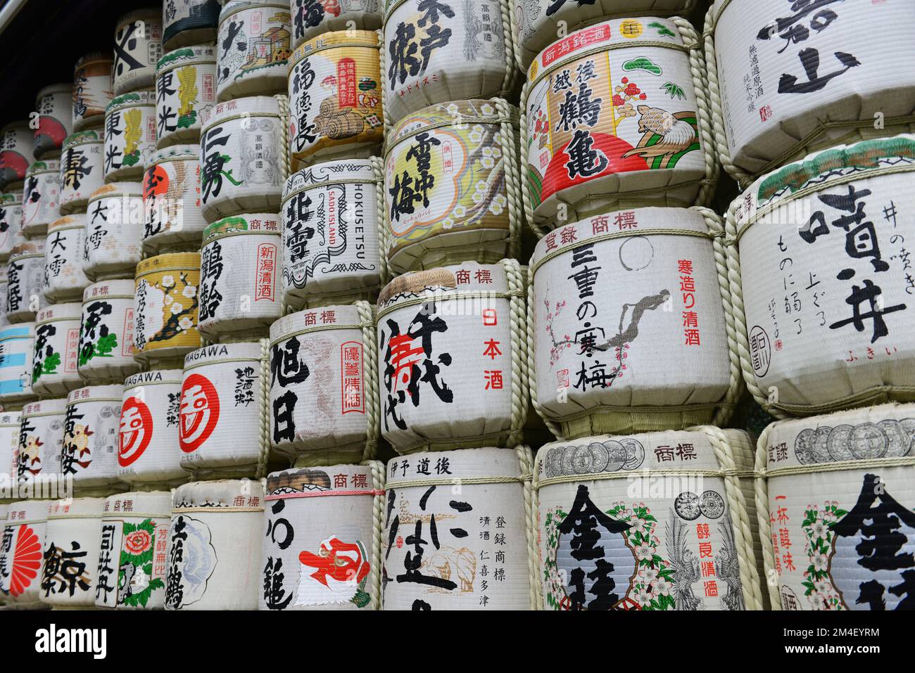 Colorful Sake barrels at the gravel road entrance to the Meiji Jingu ...