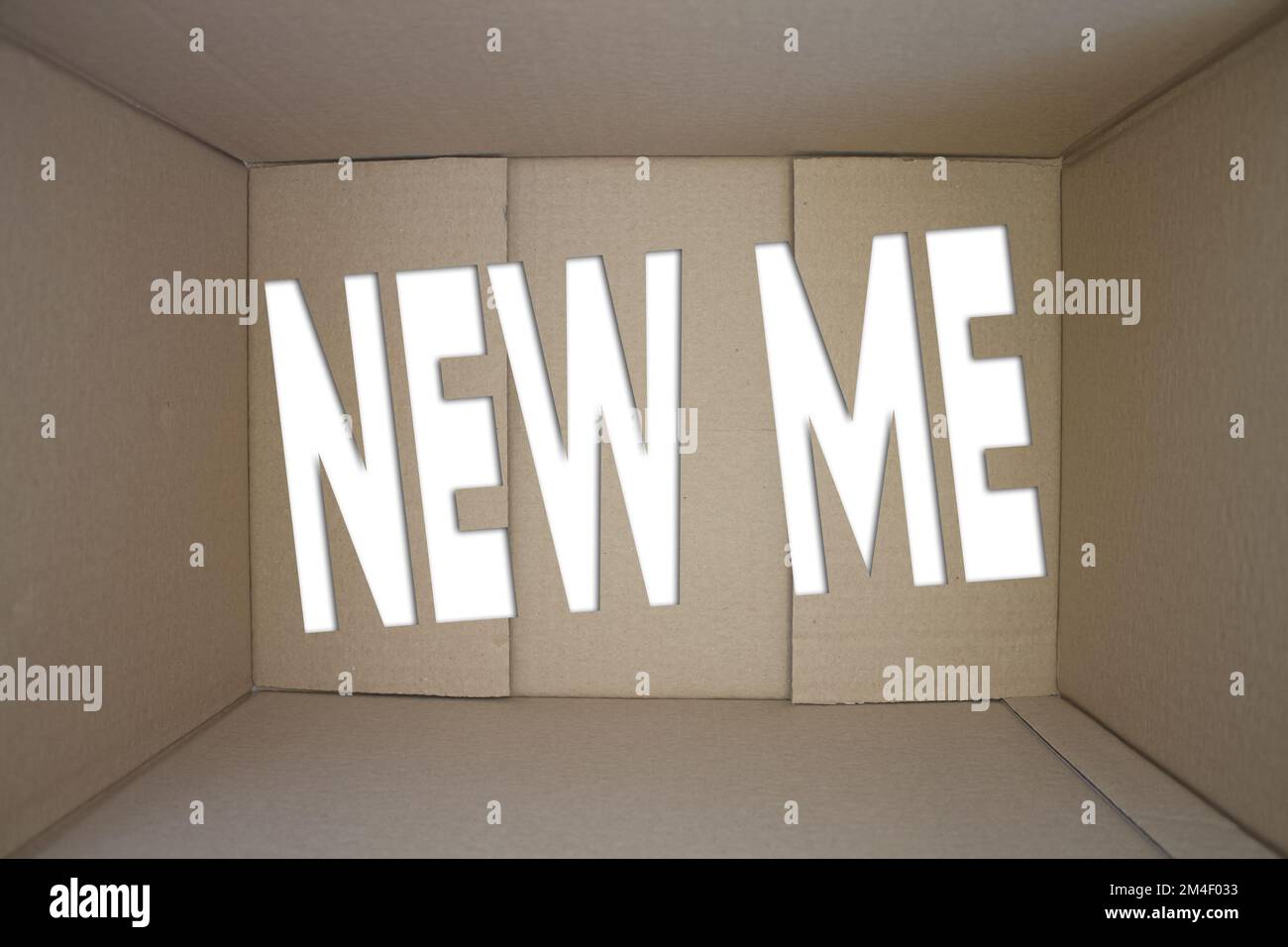 New Me word with cardboard box. Brown folded card box Stock Photo - Alamy