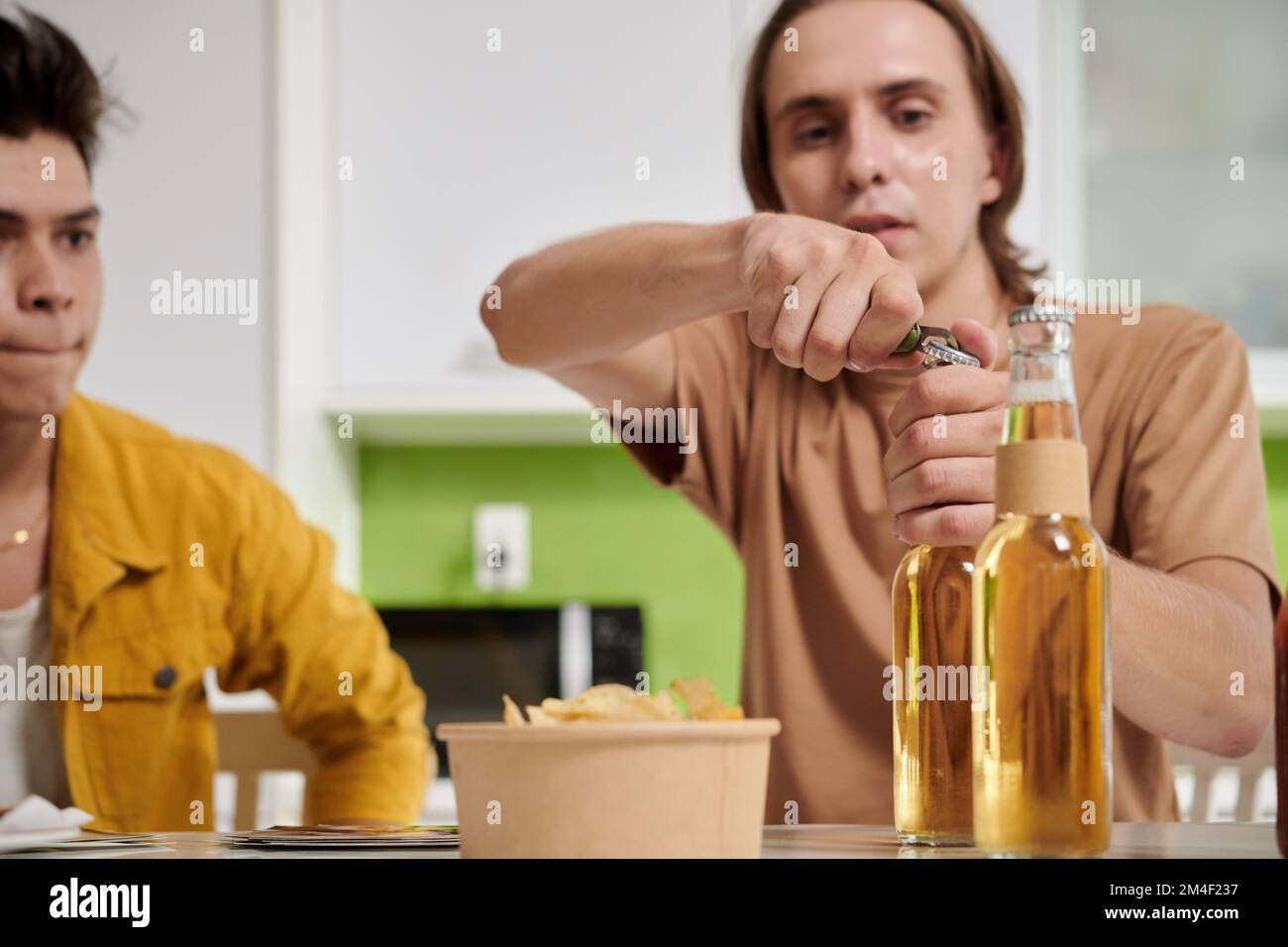 Man opening beer bottle hi-res stock photography and images - Alamy