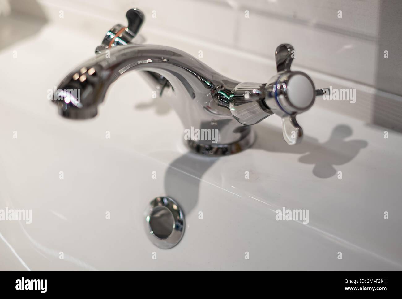 Stainless steel faucet in the bathroom. Water Tap. Close up water ...