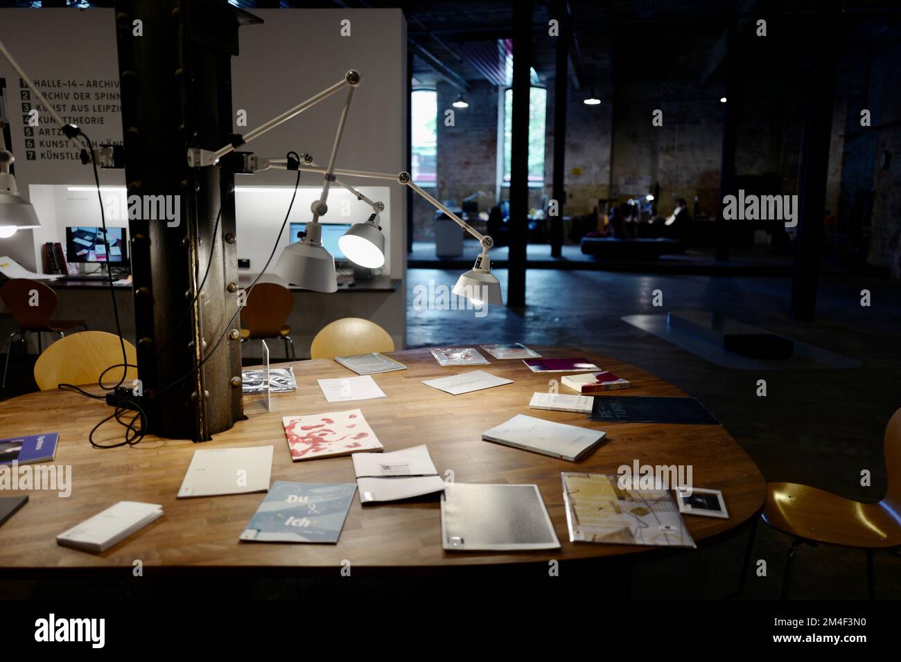 Desk with paperwork in a dark factory Stock Photo - Alamy
