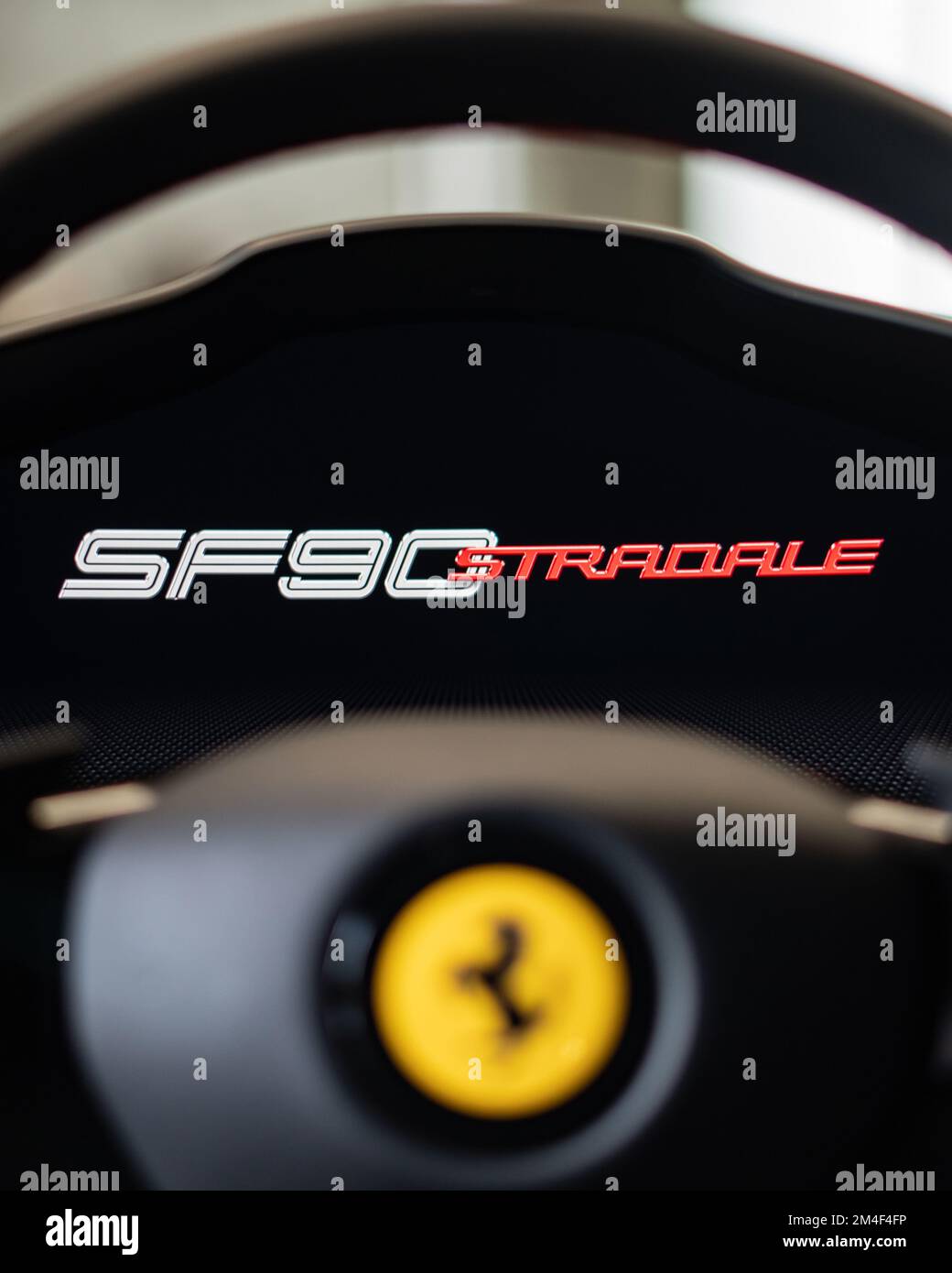 A Ferrari SF-90 Stradale digital gauge cluster with the model name on ...