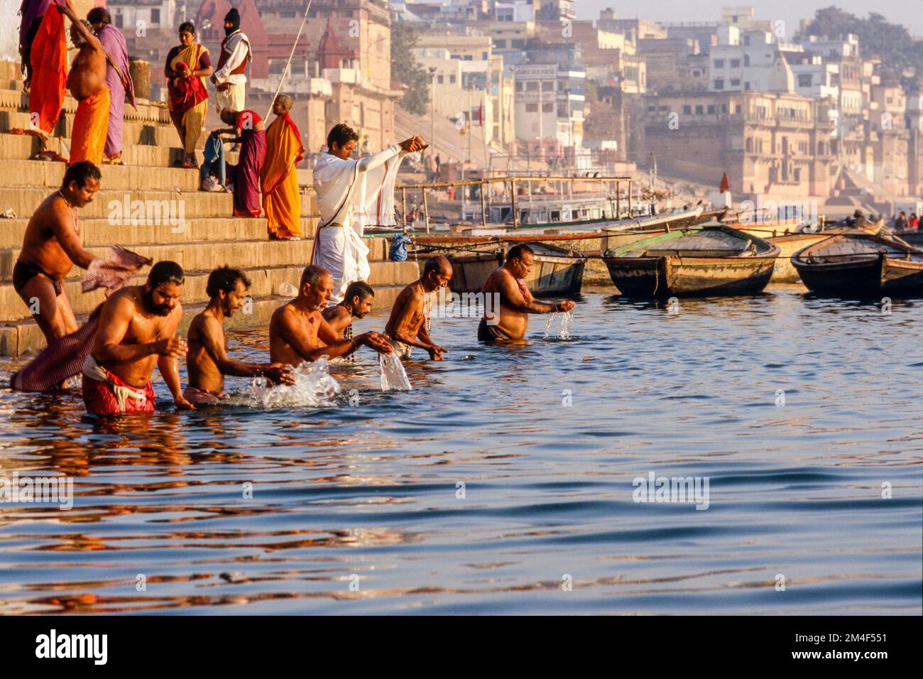 The ghats are busy with pilgrims every morning Stock Photo - Alamy