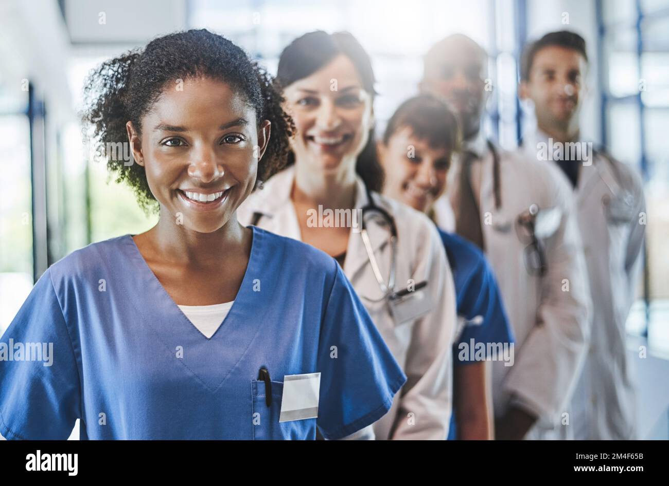 Confident doctors delivering quality care. Portrait of a diverse team ...