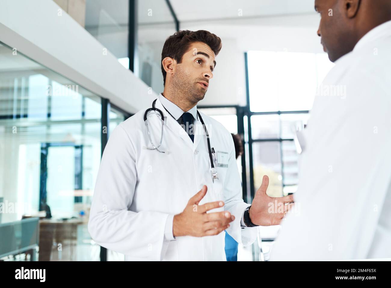 Pulling together for quality patient care. two doctors having a ...