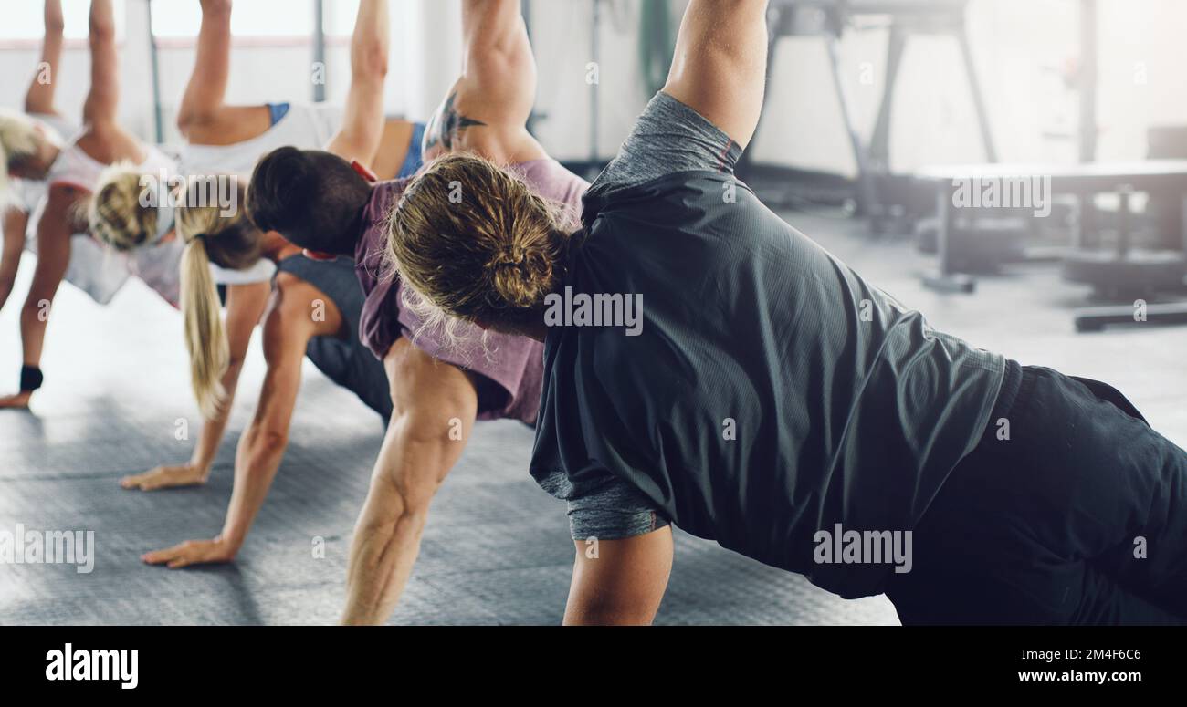 How calories are burned and muscles are earned. a group of young people ...