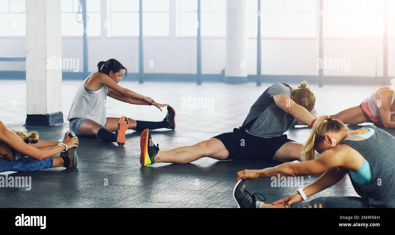 Find your fitness fam. a group of young people working out together in ...