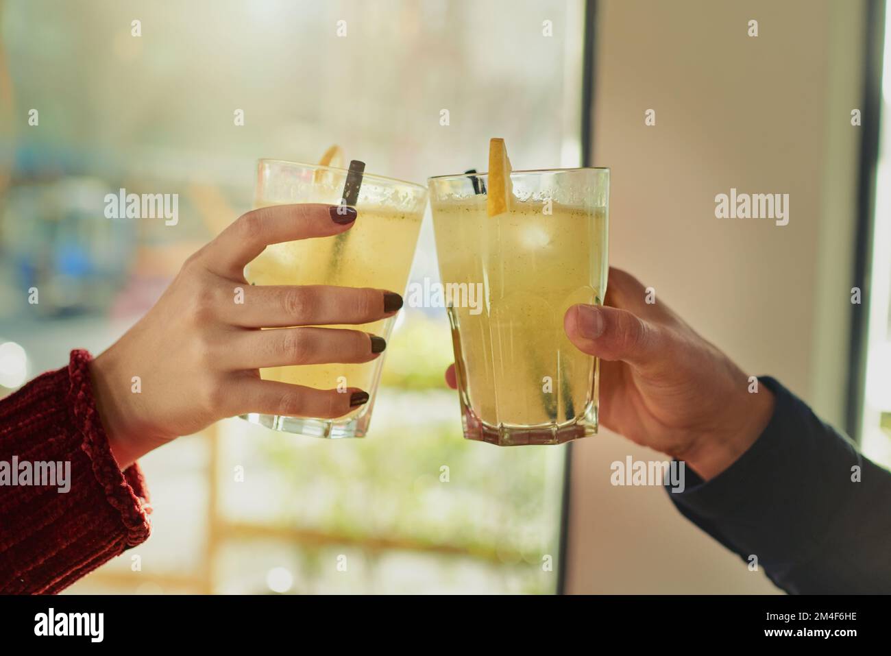 Celebrate every moment. a couple toasting with their drinks at a coffee ...