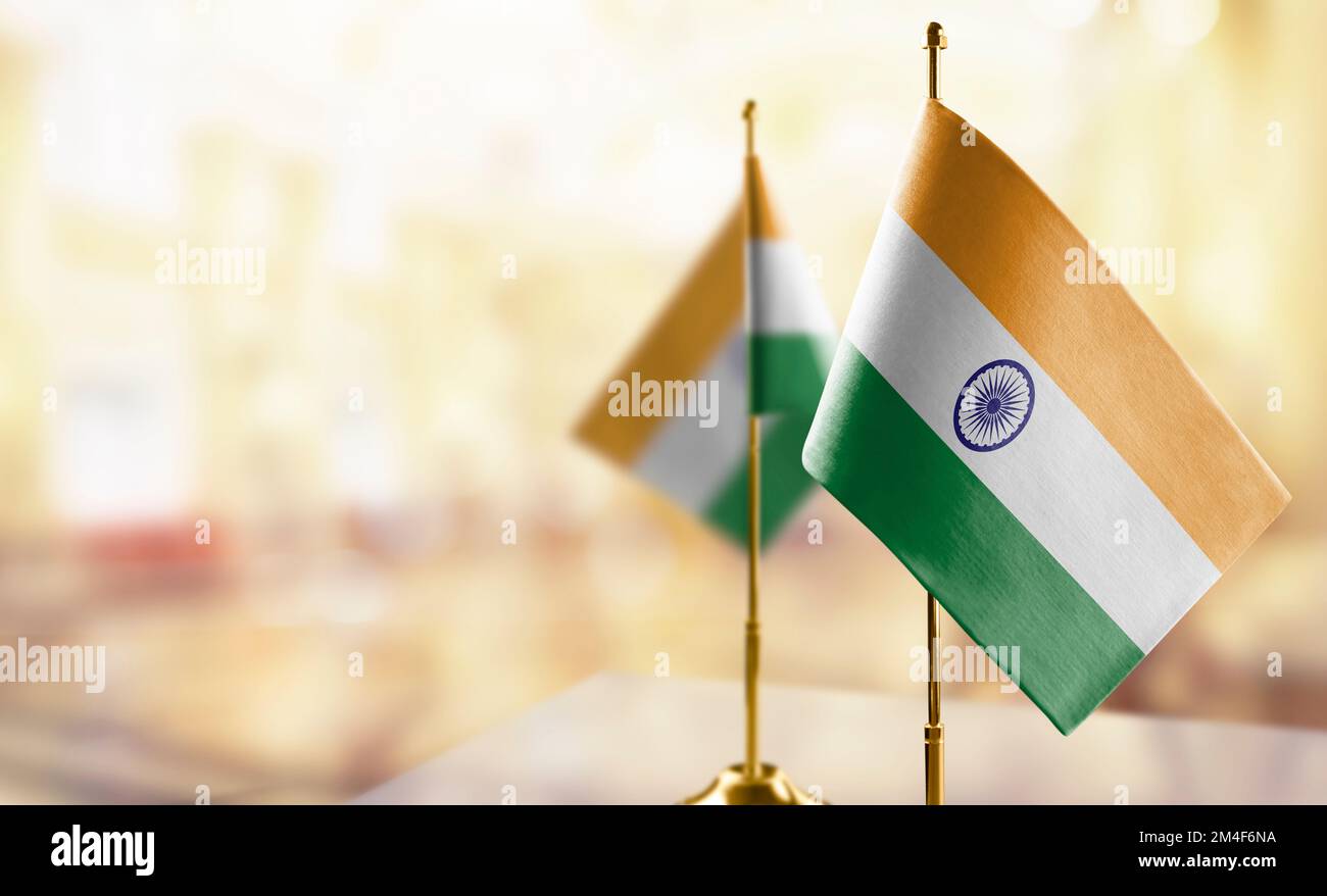 Small flags of the India on an abstract blurry background Stock Photo ...