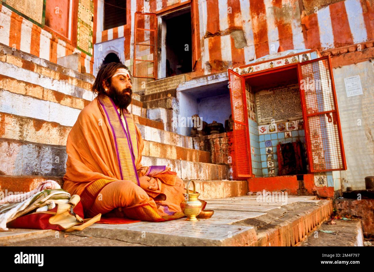 Sadhu meditating at the ghats of Varanasi Stock Photo - Alamy