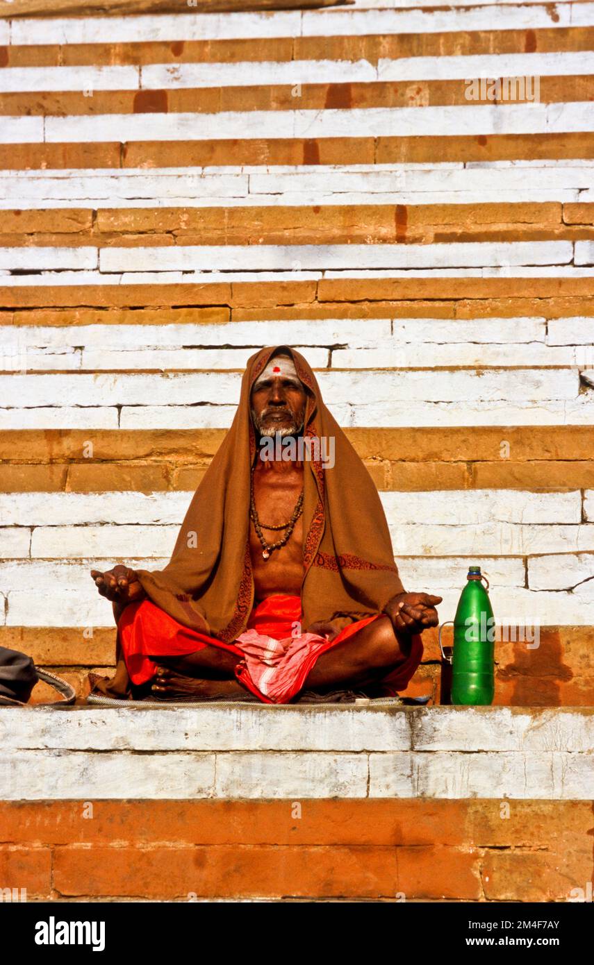 Sadhu meditating at the ghats of Varanasi Stock Photo - Alamy