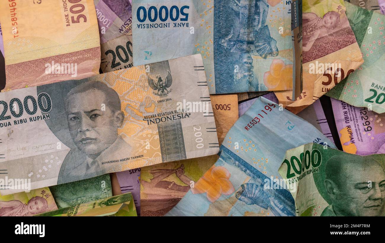 pile of rupiah banknotes as background Stock Photo - Alamy
