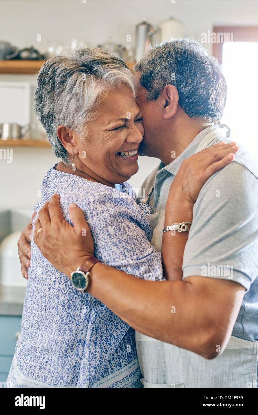 True love has no end to it. a mature couple dancing in the kitchen ...