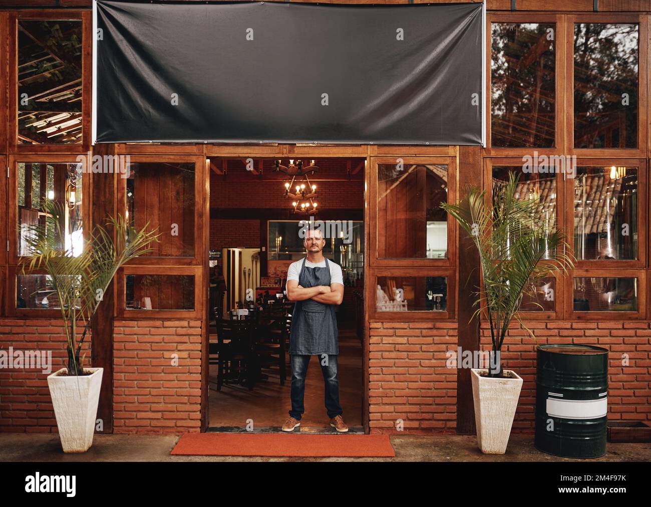 Welcome to my castle. Wide portrait of a confident middle aged business ...