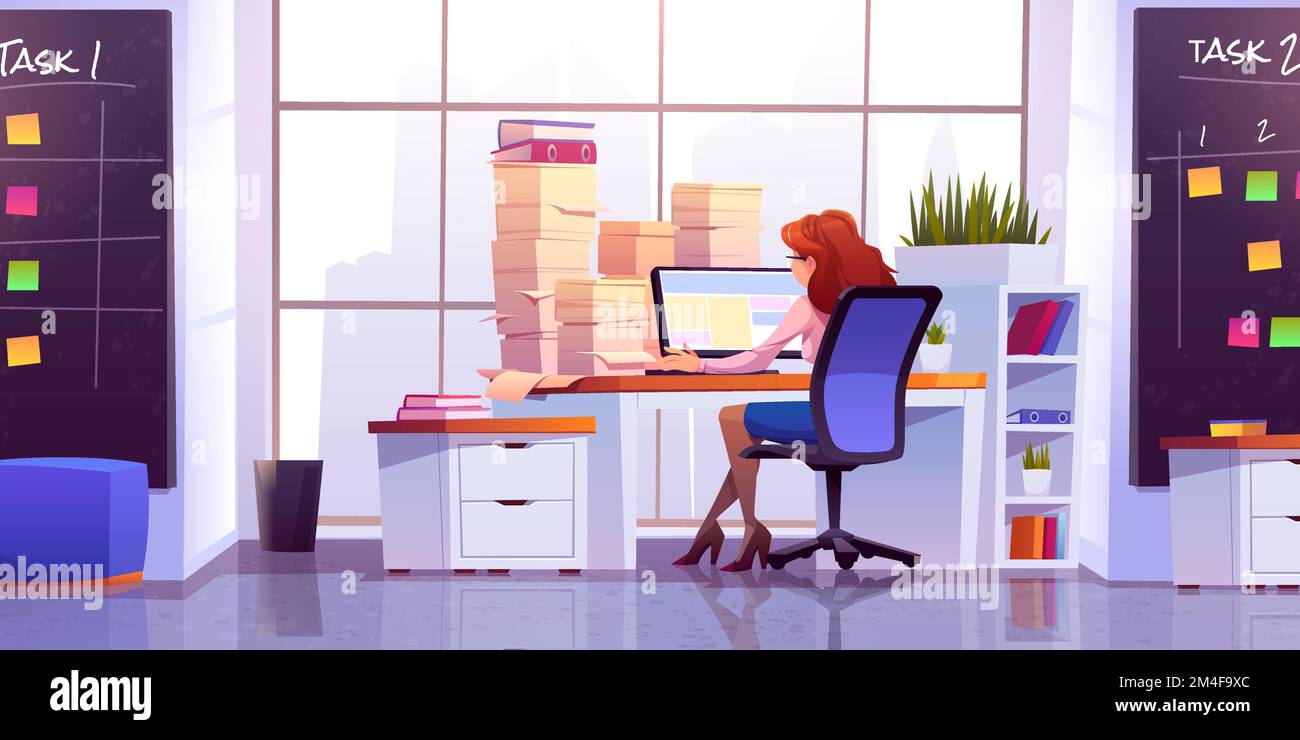 Woman working at office sitting at desk with computer and piles of ...