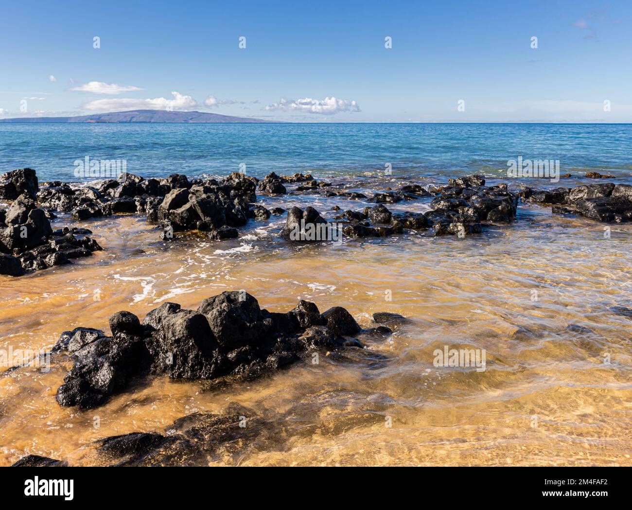 Waves Washing Over Lava Boulders on Keawakapu Beach, Maui, Hawaii, USA ...