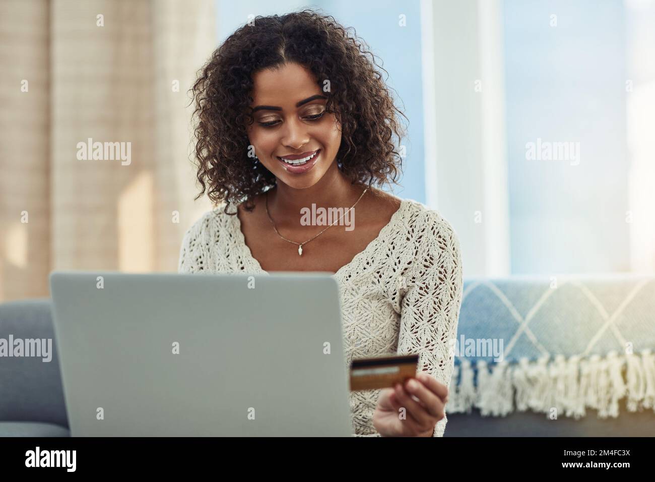 Young woman making payments online hi-res stock photography and images ...