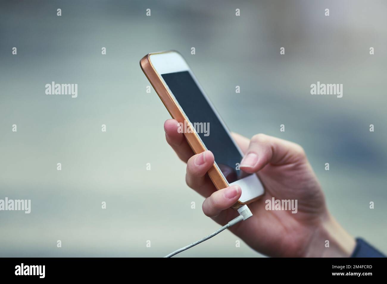 What does your playlist say about you. a woman using a mobile phone ...
