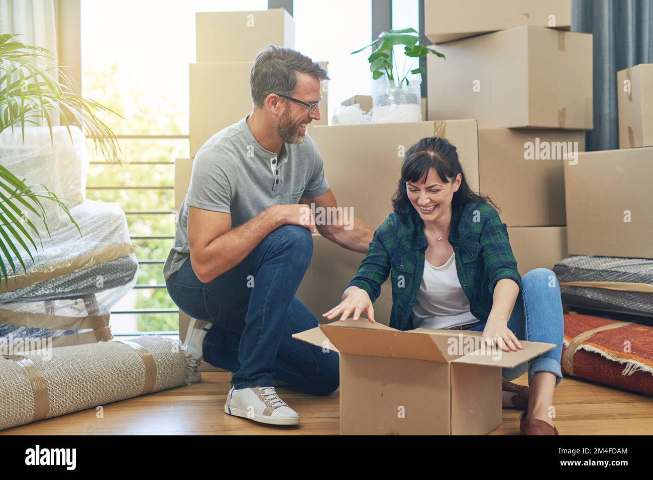 Youve made moving such an easy transition. a happy couple packing boxes ...