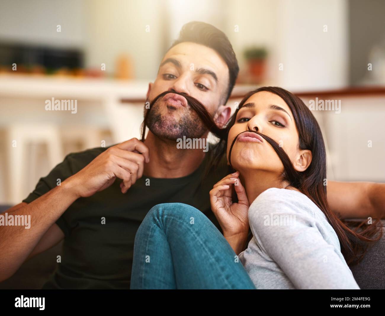 Were weird and we love it. a young couple enjoying a silly moment ...