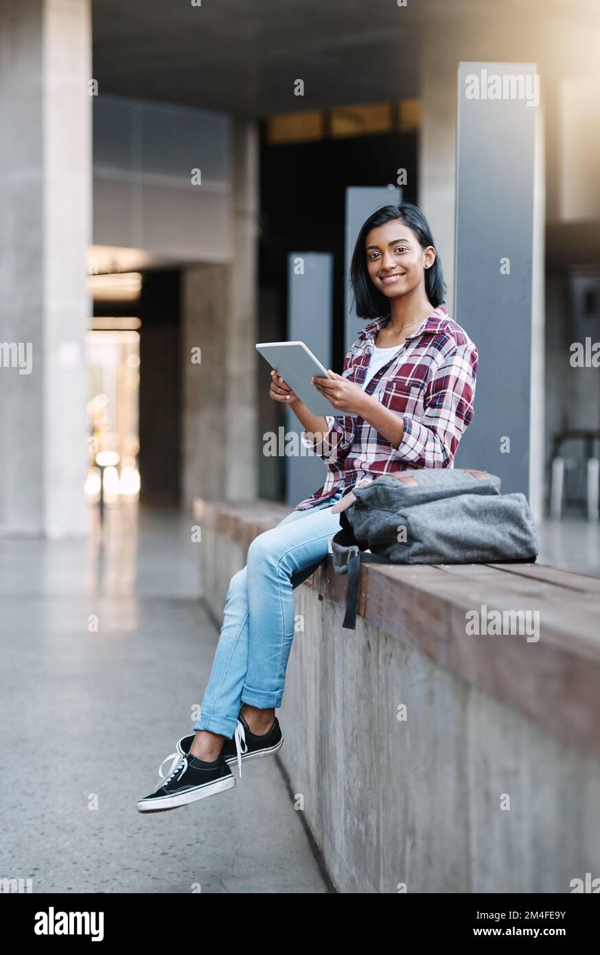 My campus has free wifi. Full length portrait of an attractive young ...