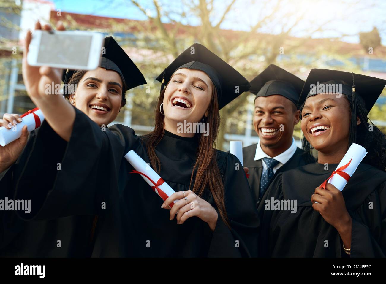 World, were coming for you. a group of students taking selfies with a ...