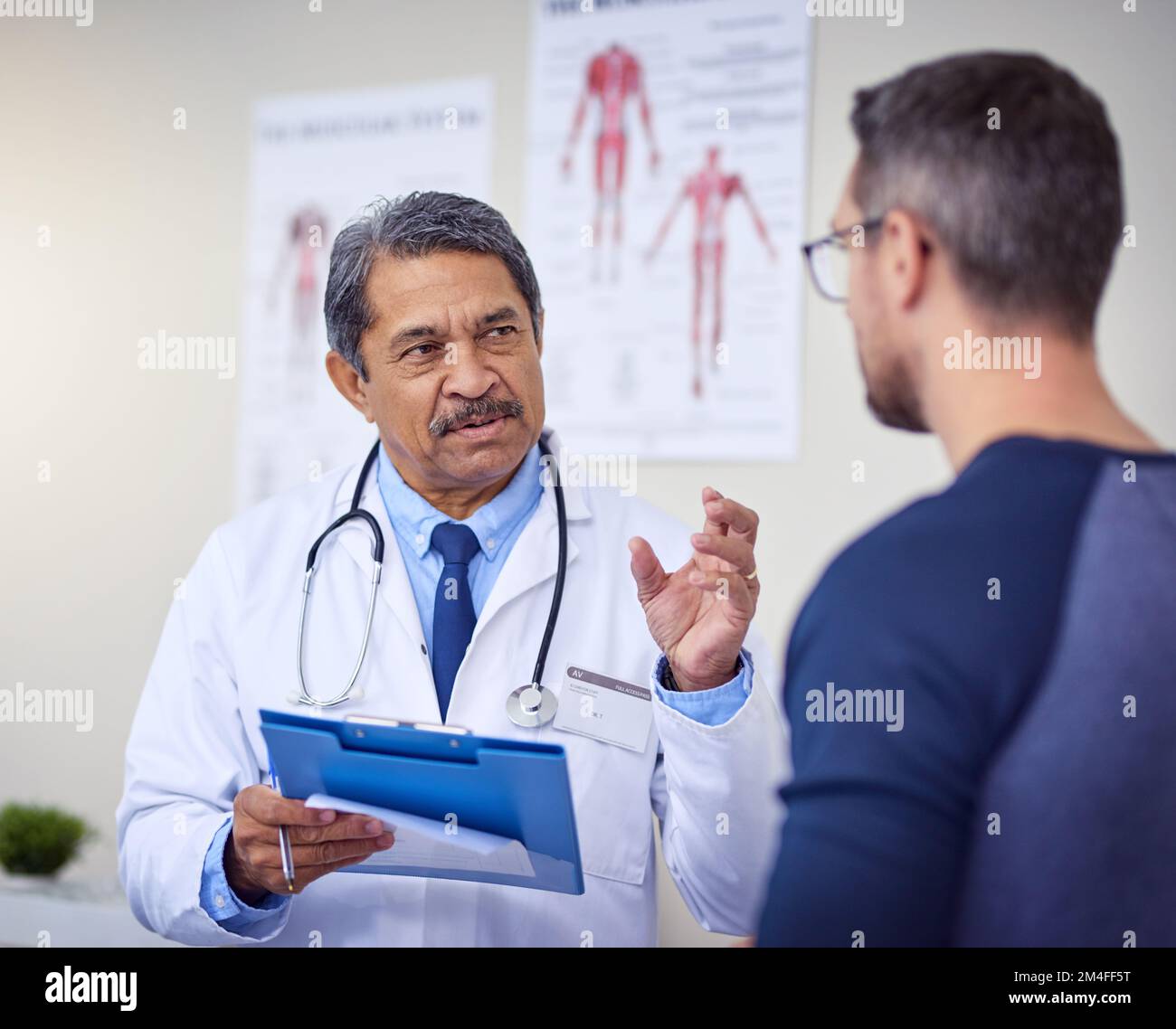 If the pain continues come see me again. a confident mature male doctor ...