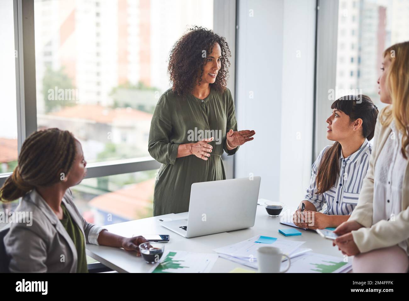 We have to work hard for what we want. a group of businesswomen having ...