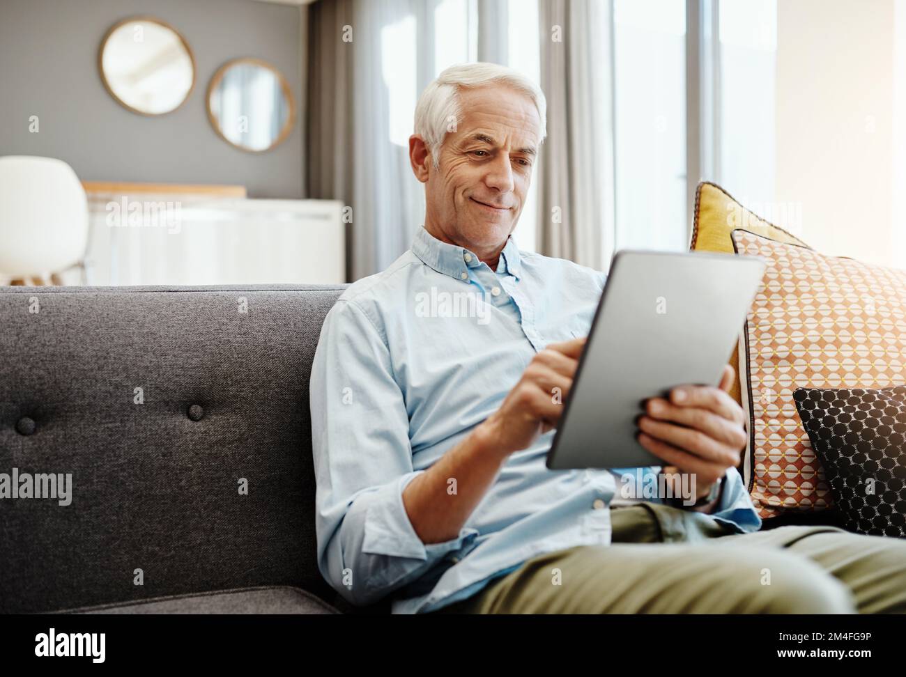 Relaxed elderly man using hi-res stock photography and images - Alamy