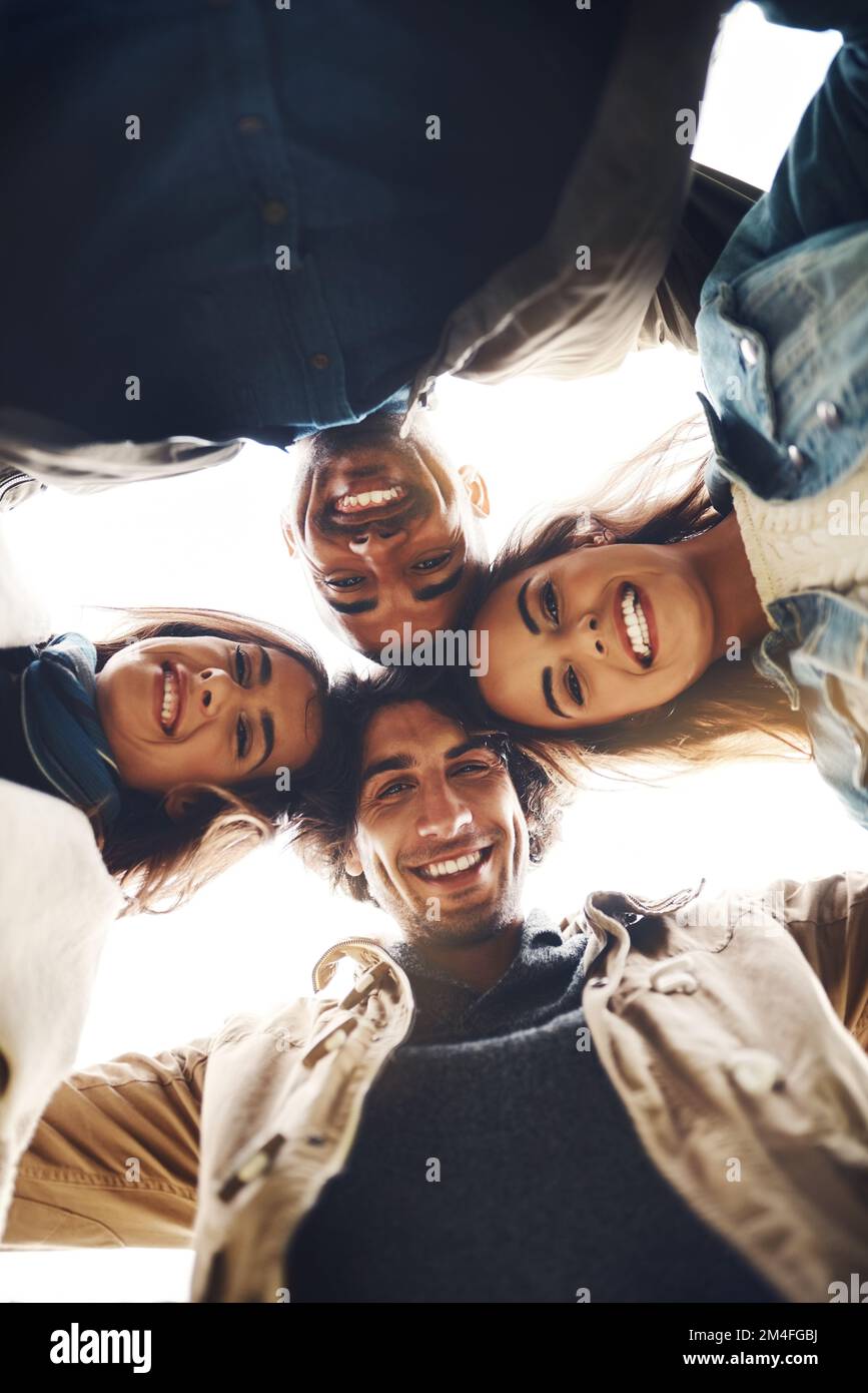 We are officially stuck together. Low angle portrait of a group of ...