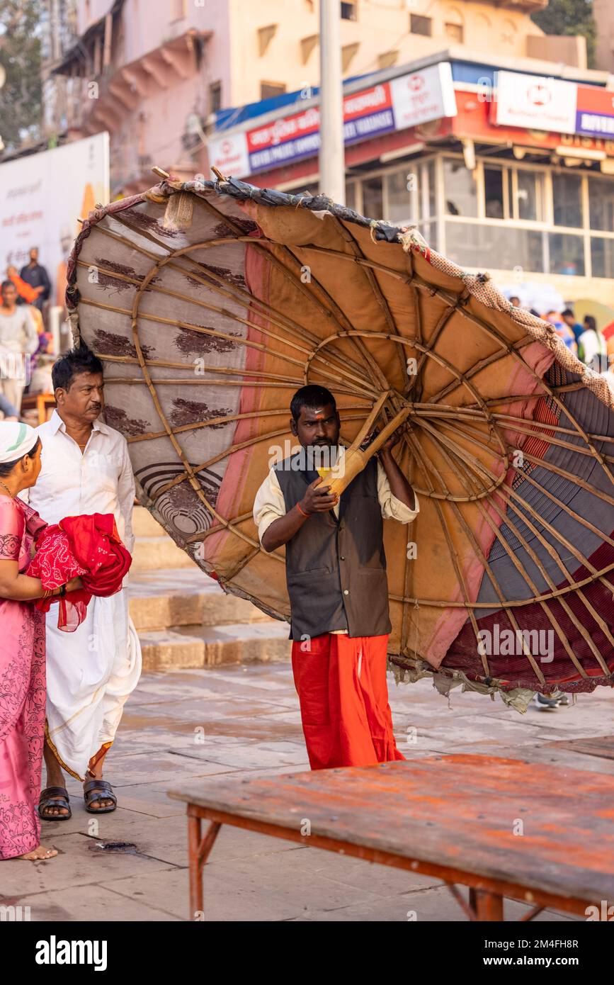 Varanasi, India - November 2022: Tourists performing rituals along with ...