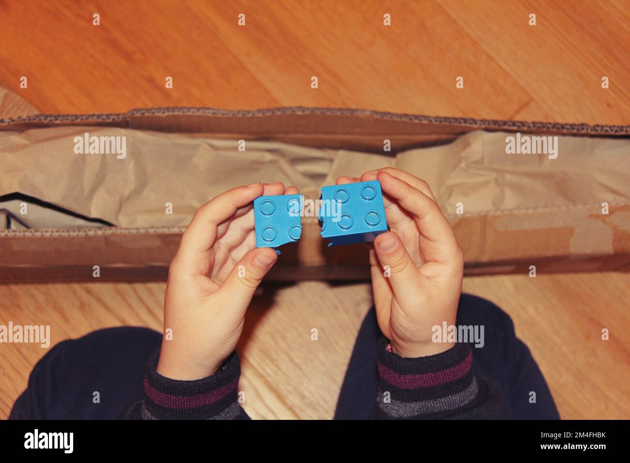 Broken toy in damaged cardboard box top view, damaged home delivery ...