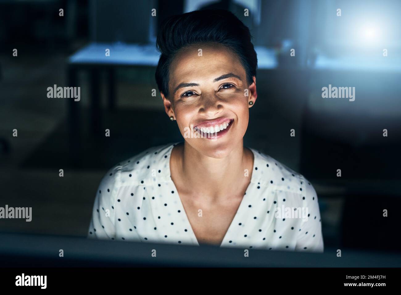 Her job makes her happy. Portrait of a cheerful young female programmer ...