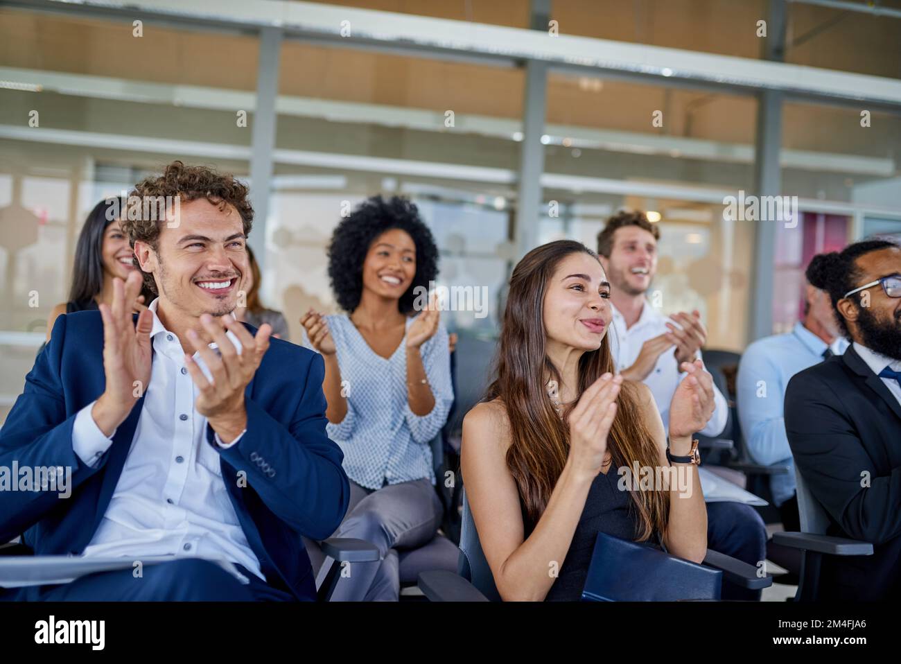 The whole audience are left inspired. businesspeople applauding during ...