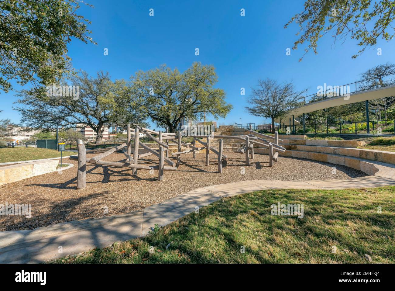 Austin, Texas- Waterloo Park playground with wood logs structure with ...