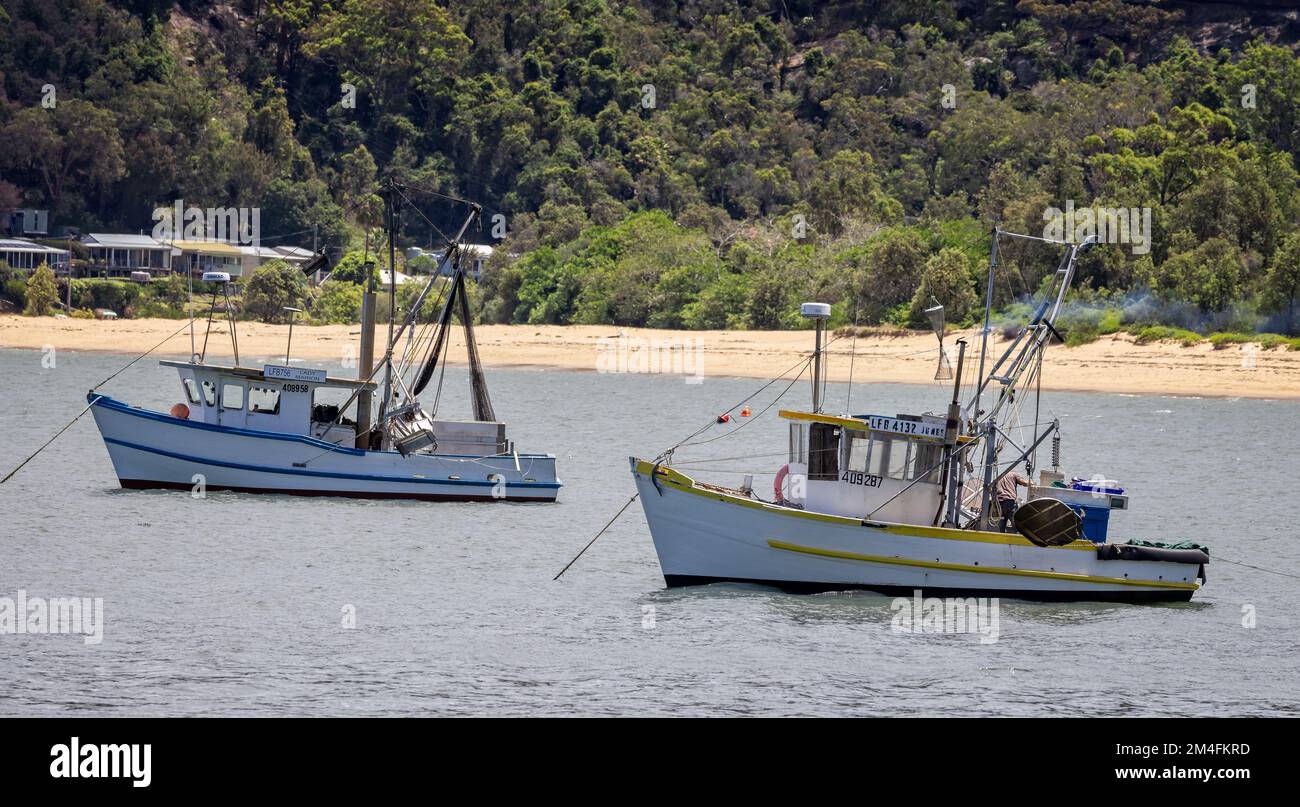 Pair of fishing boats moored in bay at Patonga Beach, New South Wales ...