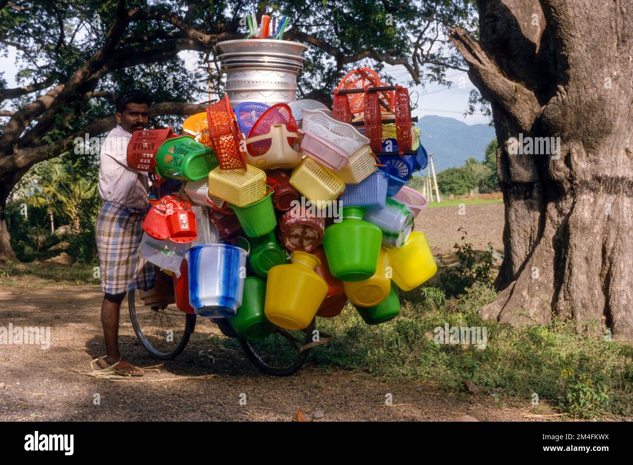 Plastik-goods seller on the streets of Andhra Pradesh Stock Photo - Alamy