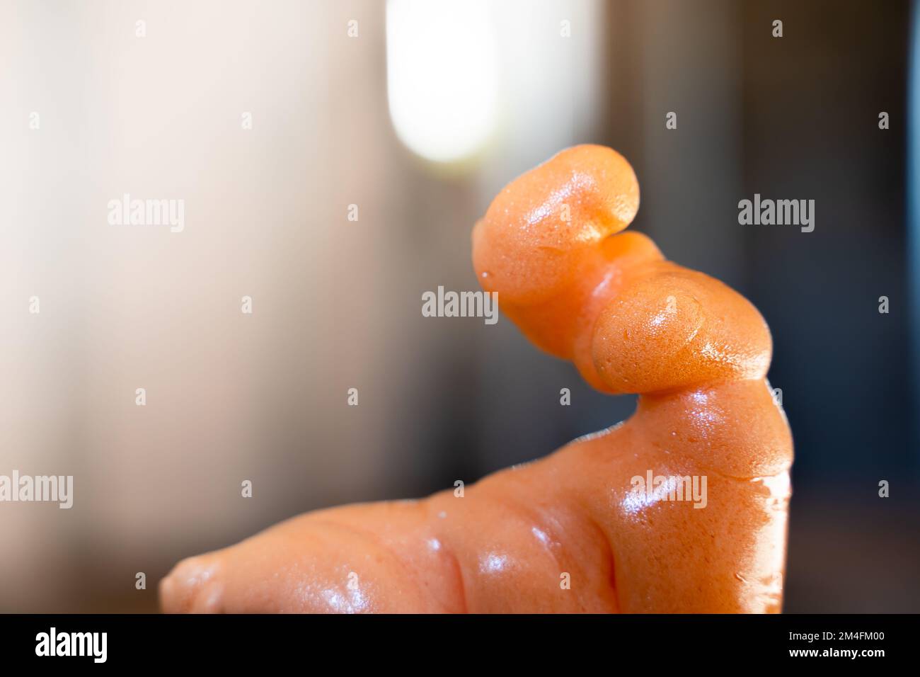 Universal polyurethane foam orange close-up on a blurred background ...