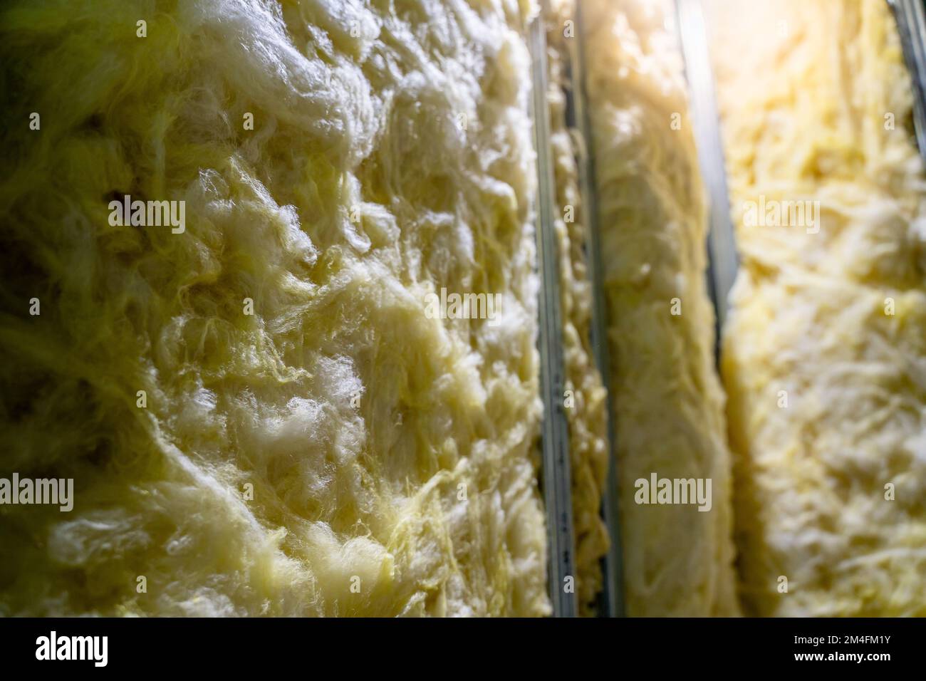 Glass wool between metal profiles in the wall. Universal insulation ...