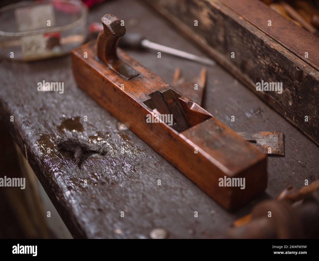 A volunteer restores an old wood planer in the machine workshop in ...