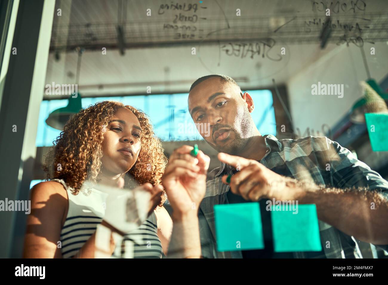 Working together to get this formula right. two focussed young work ...