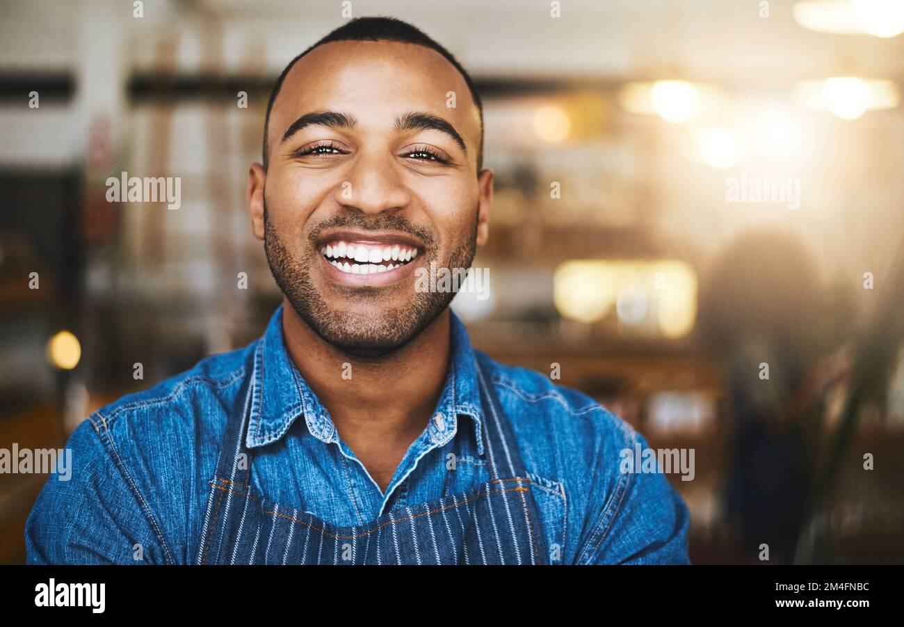 Welcoming you with a smile. Cropped portrait of a handsome young man ...