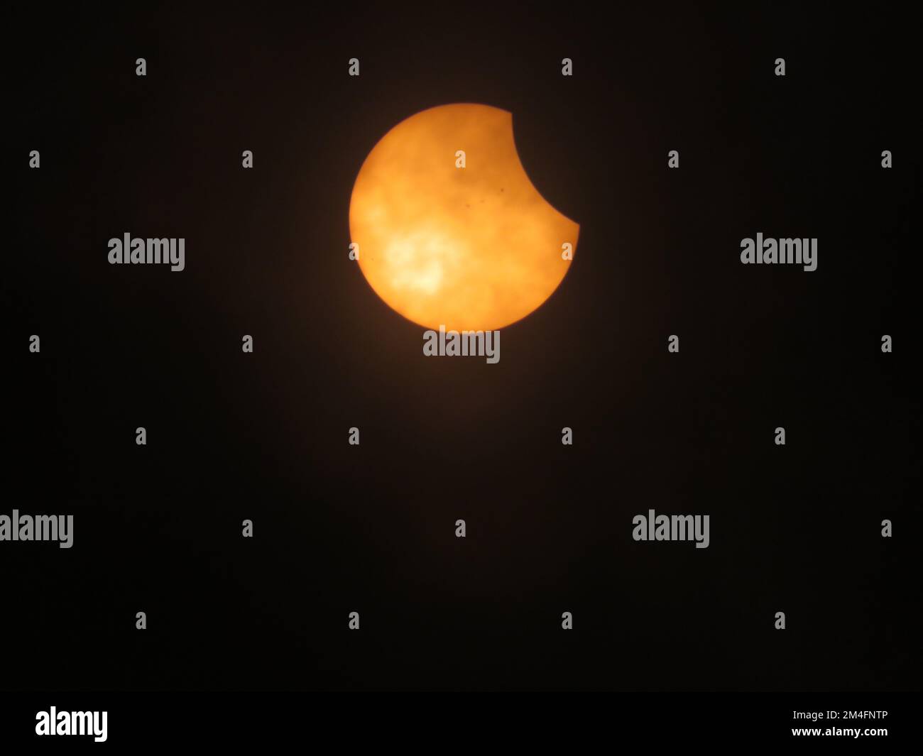 A close-up shot of solar eclipse on black background seen from the ...