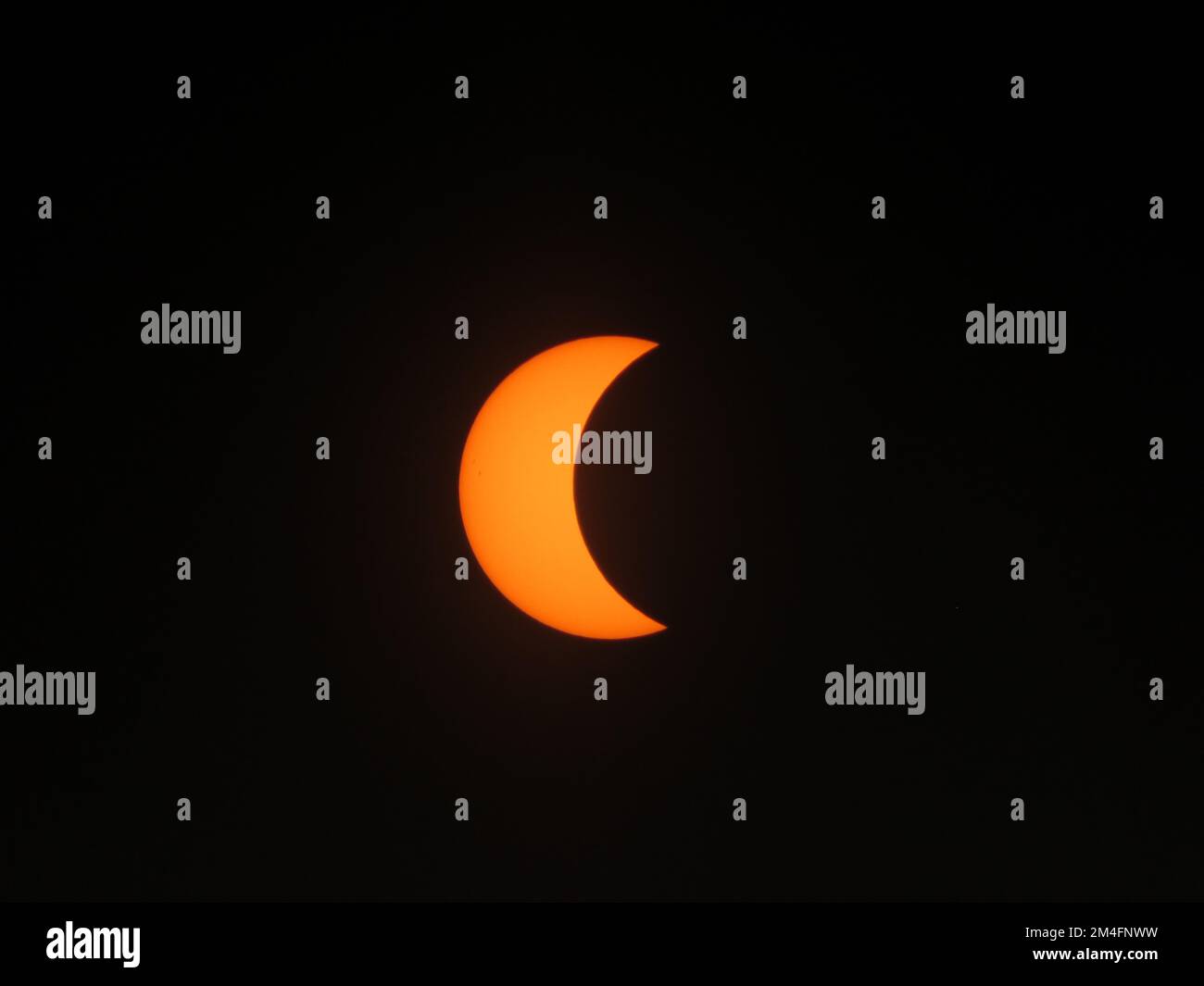 A close-up shot of solar eclipse on black background seen from the ...