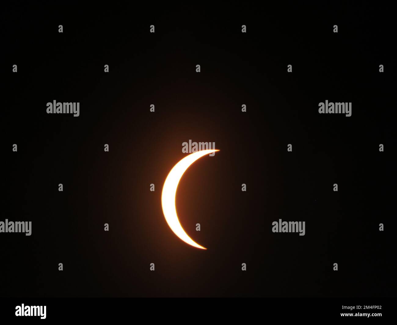 A close-up shot of solar eclipse on black background seen from the ...