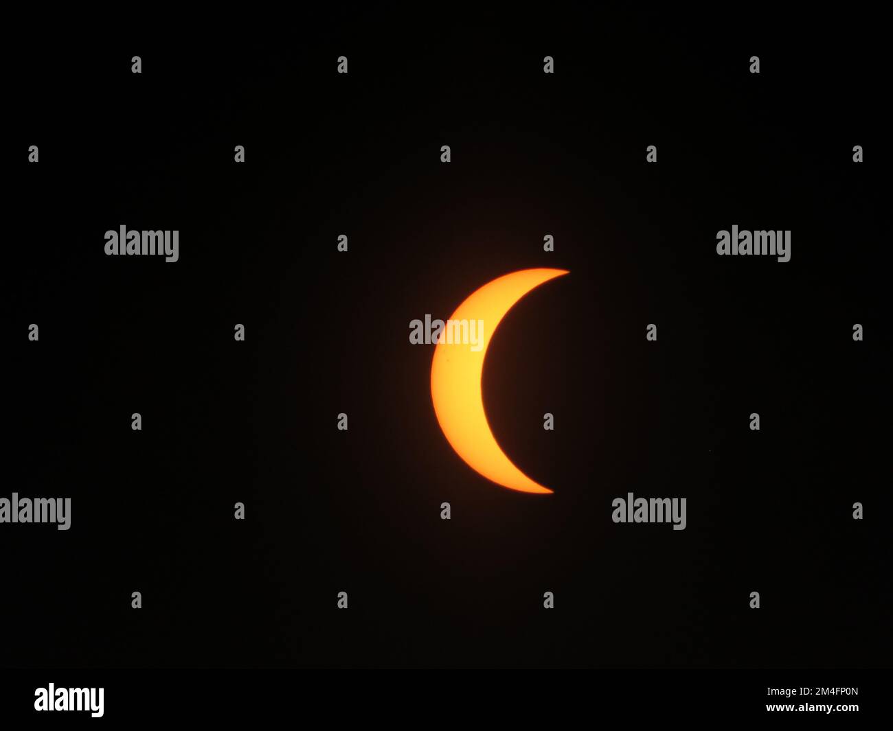 A close-up shot of solar eclipse on black background seen from the ...