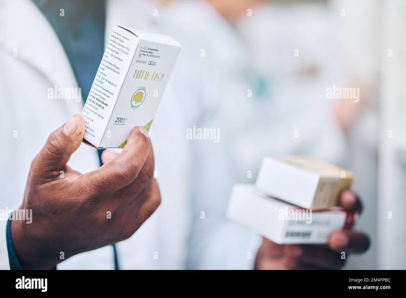 Pharmacy, black man and hand of pharmacist with medicine boxes. Pills ...