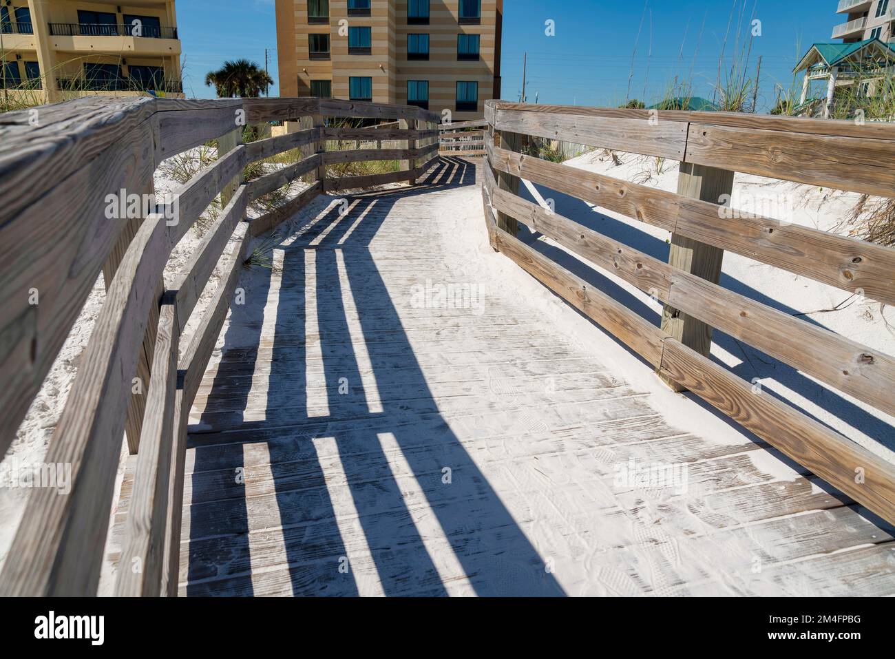 Destin, Florida- Boardwalk with wooden barrier and wood planks pathway ...